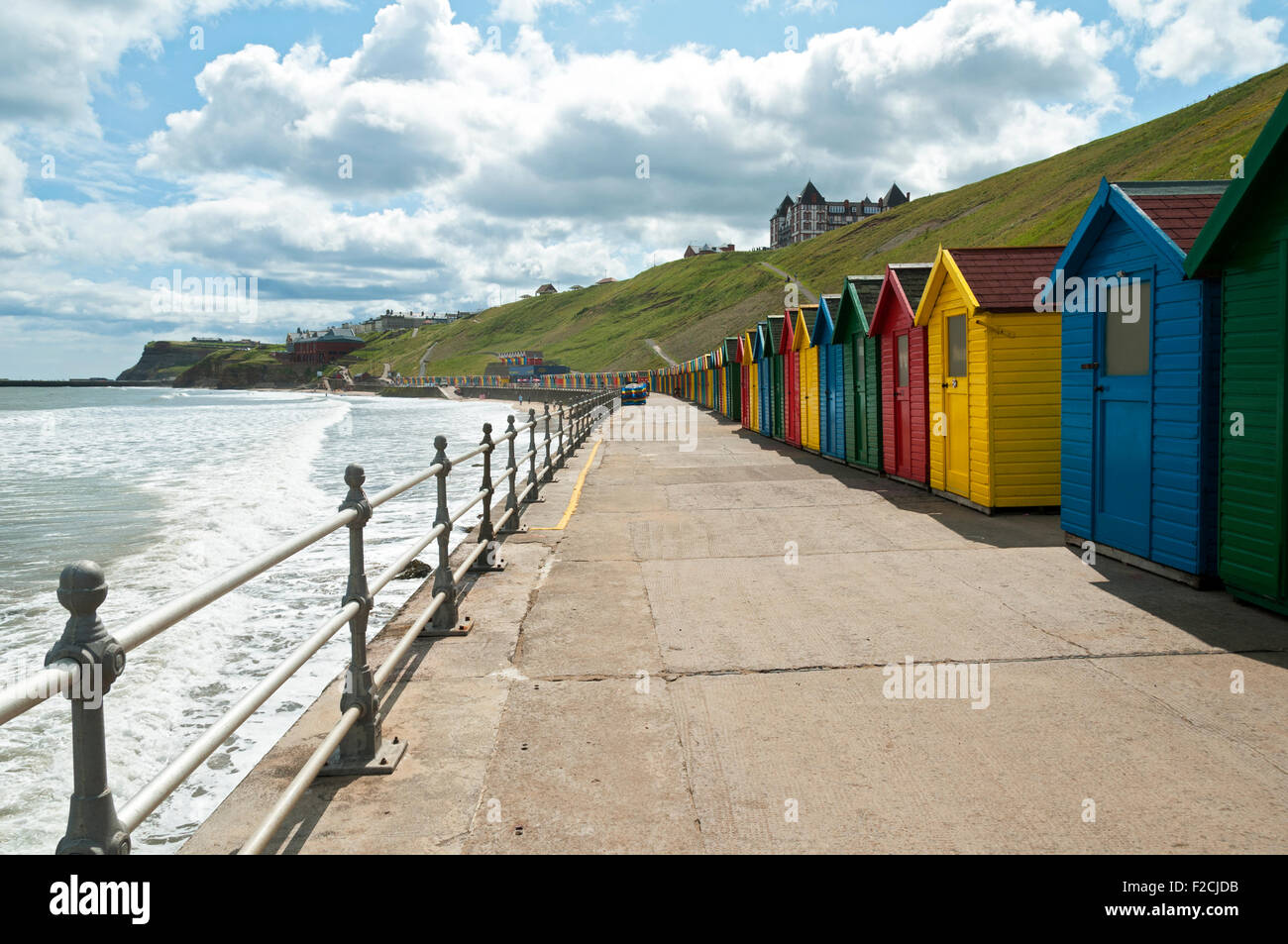 Multi-coloured beach huts at Whitby Beach, Whitby, Yorkshire, England ...