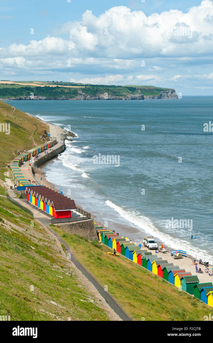 Multi-coloured beach huts at Whitby Beach, Whitby, Yorkshire, England ...