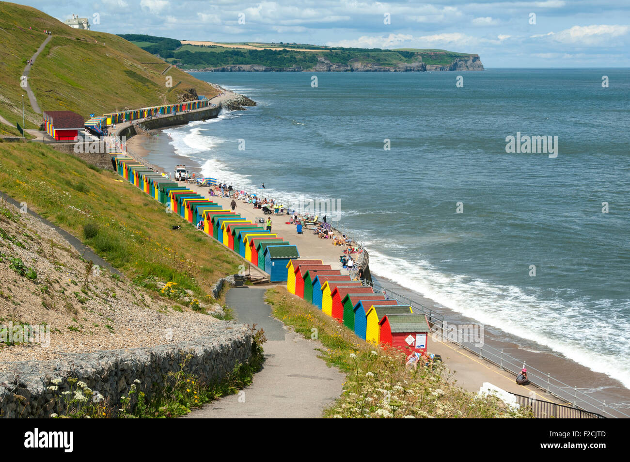 Multi-coloured beach huts at Whitby Beach, Whitby, Yorkshire, England ...