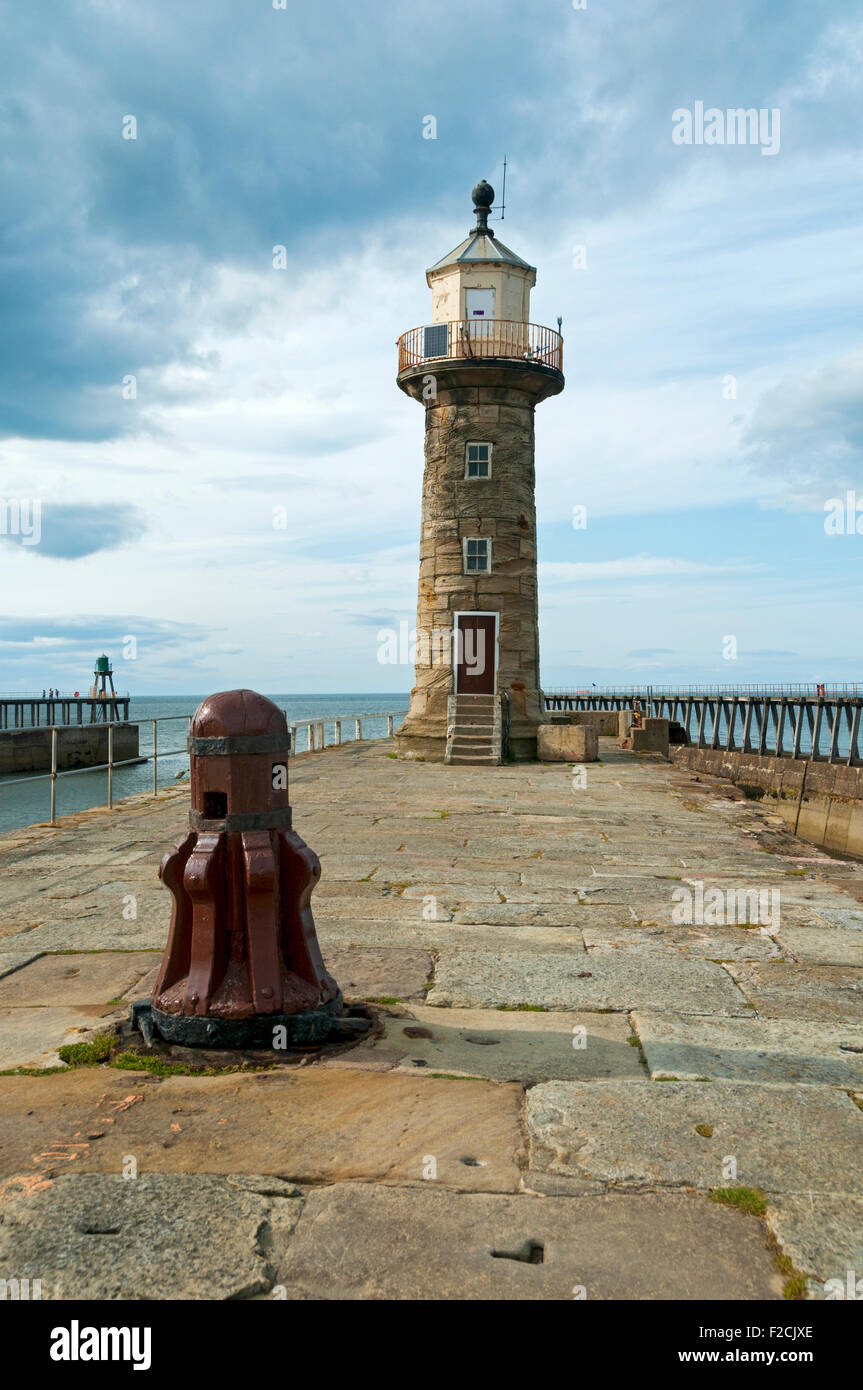 Old capstan and lighthouse on the East Pier of Whitby Harbour, Whitby ...