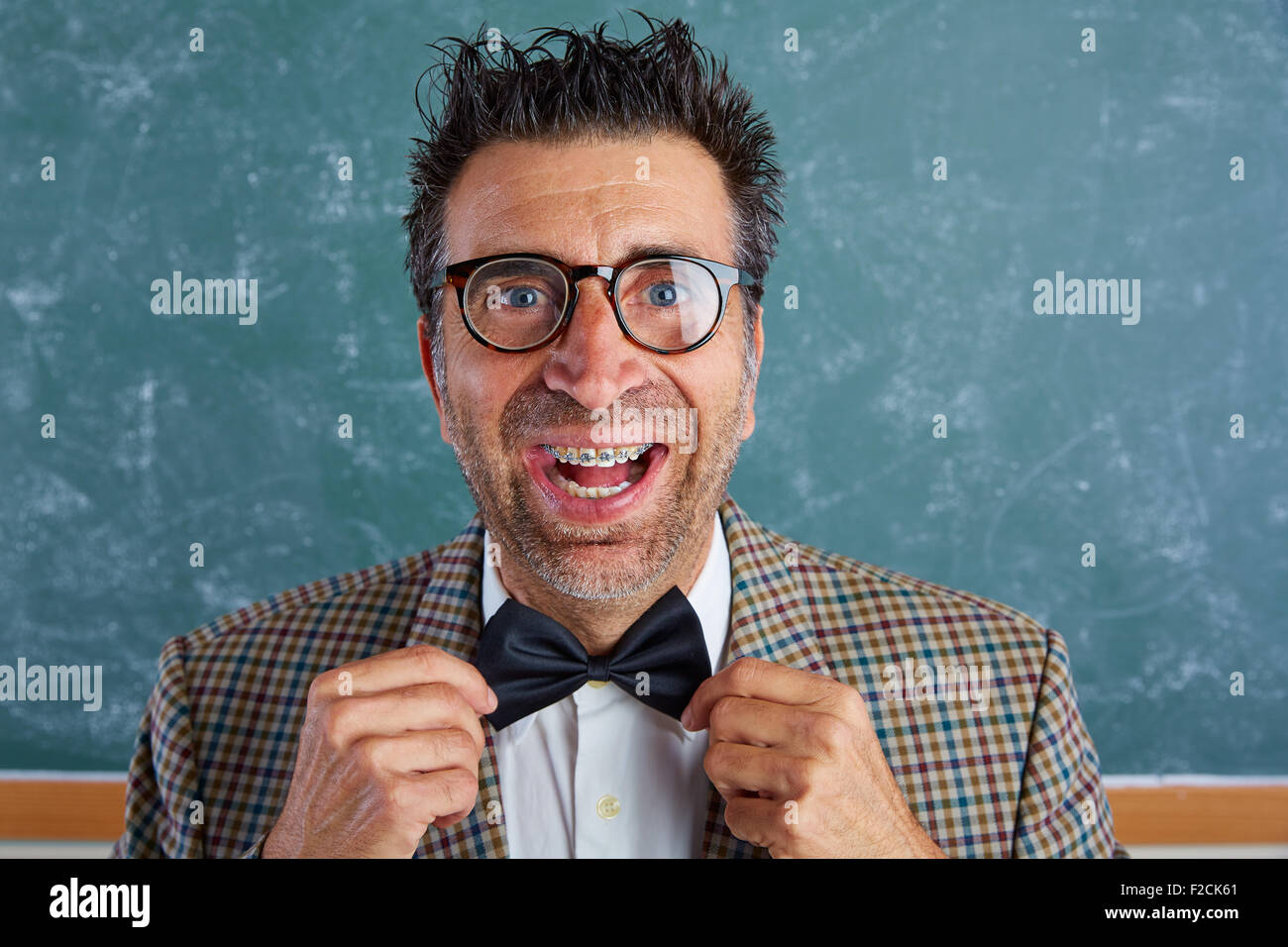 Nerd silly retro teacher man with braces funny expression bow tie ...
