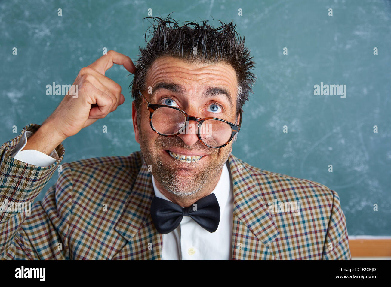 Nerd silly retro teacher man with braces funny thinking doubt ...