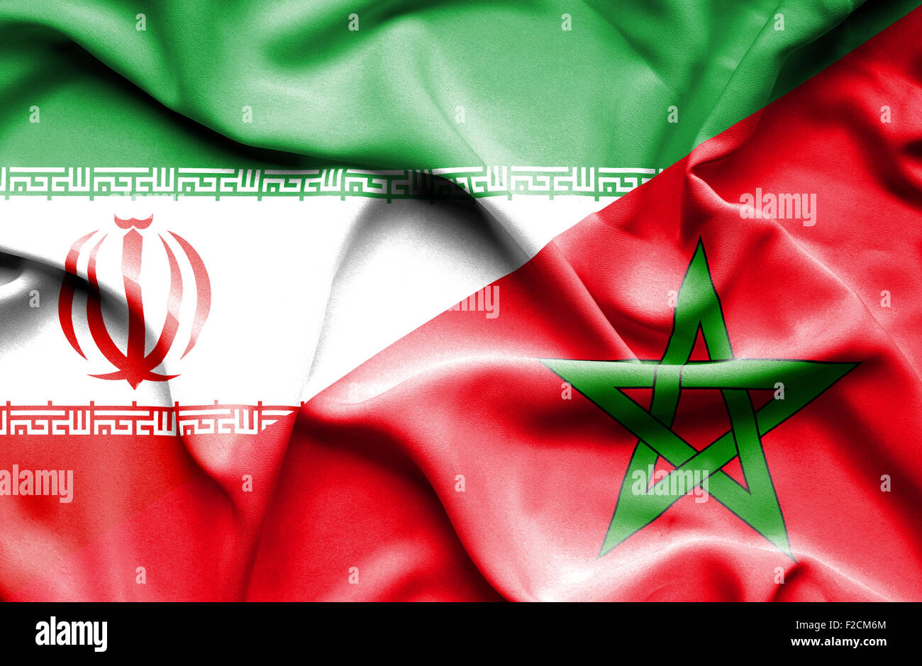 Waving flag of Morocco and Iran Stock Photo - Alamy