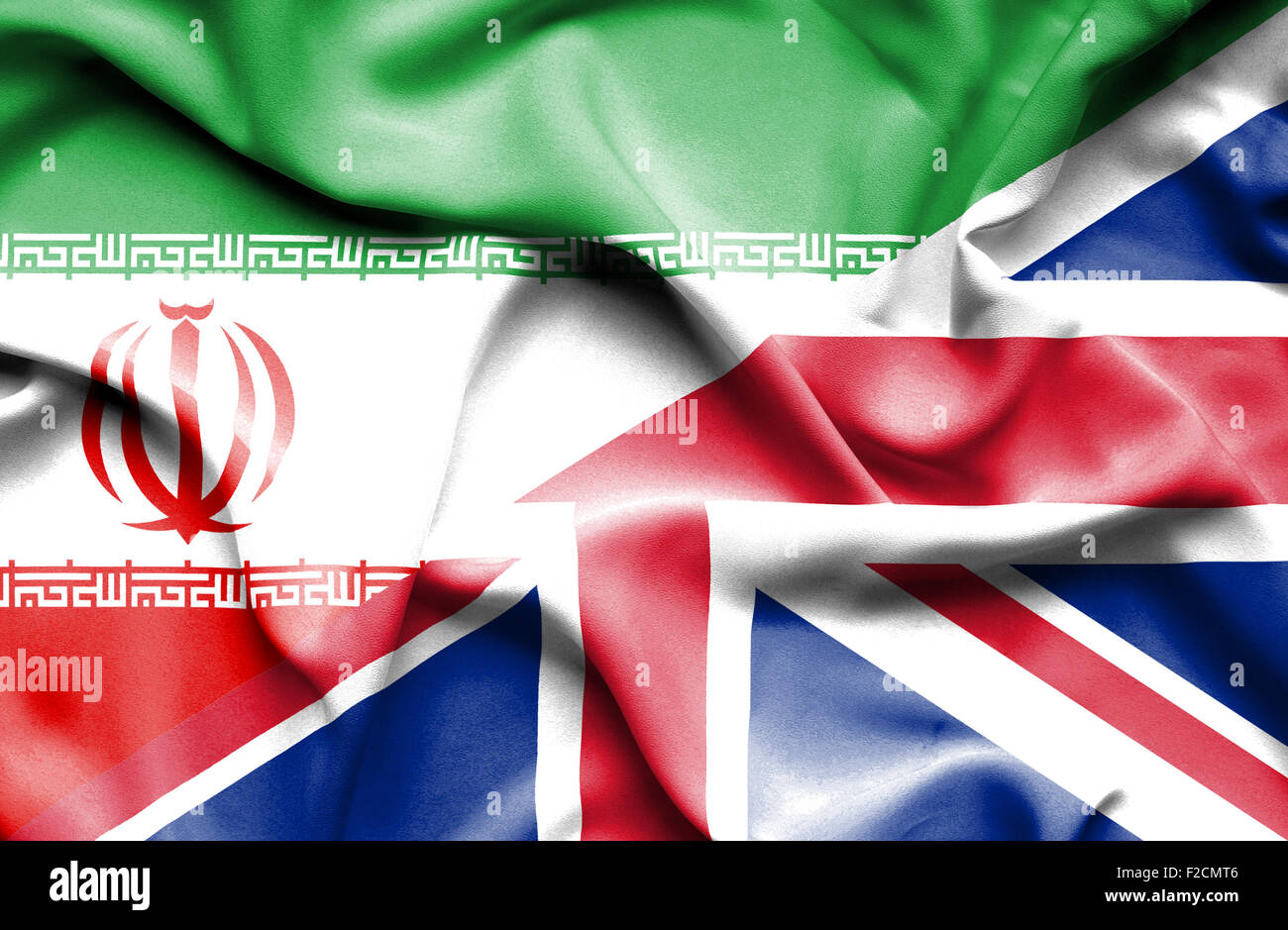 Waving flag of United Kingdom and Iran Stock Photo - Alamy