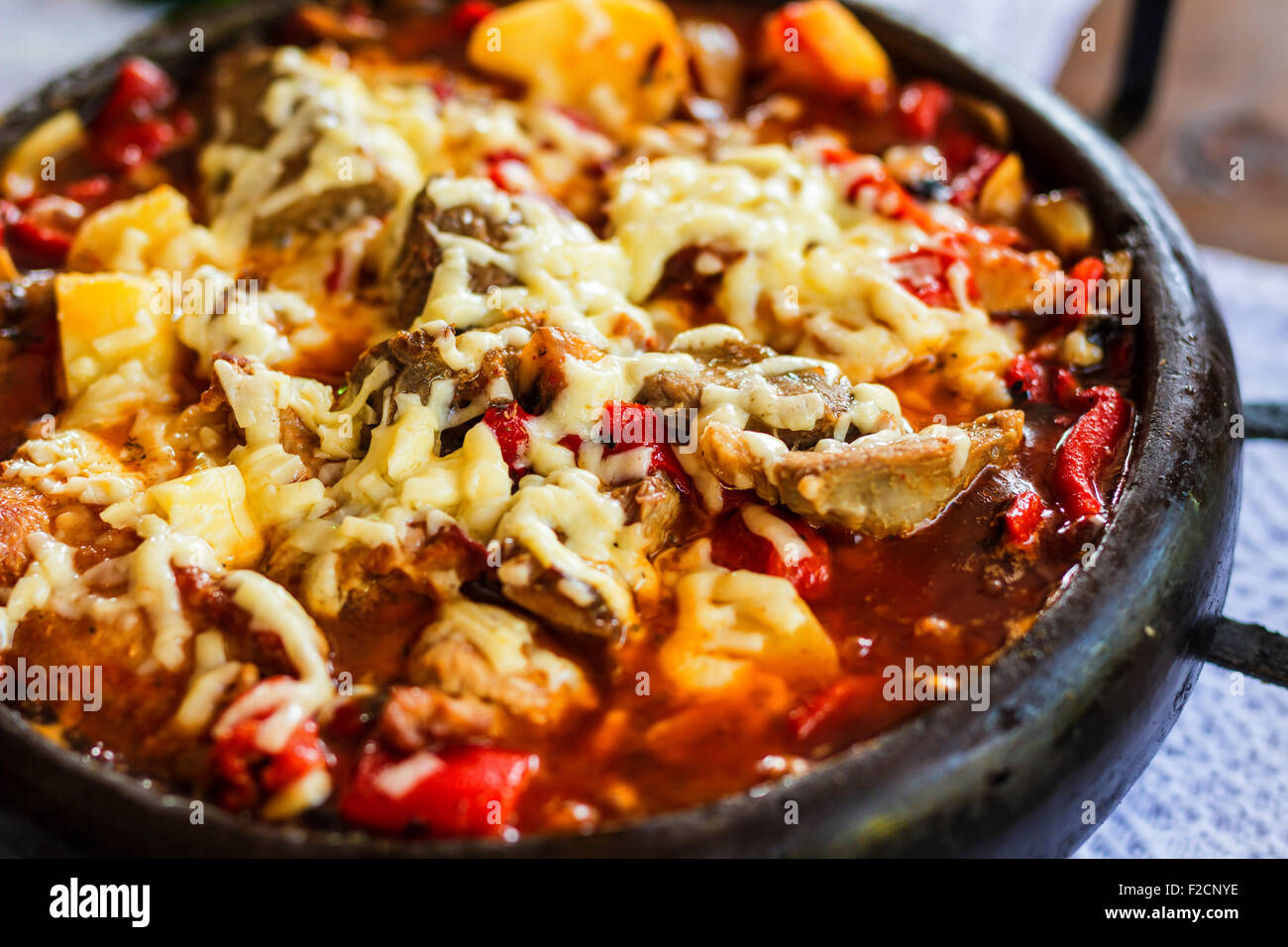 Meat with cheese on clay try. Bulgarian traditional cuisine sach Stock ...