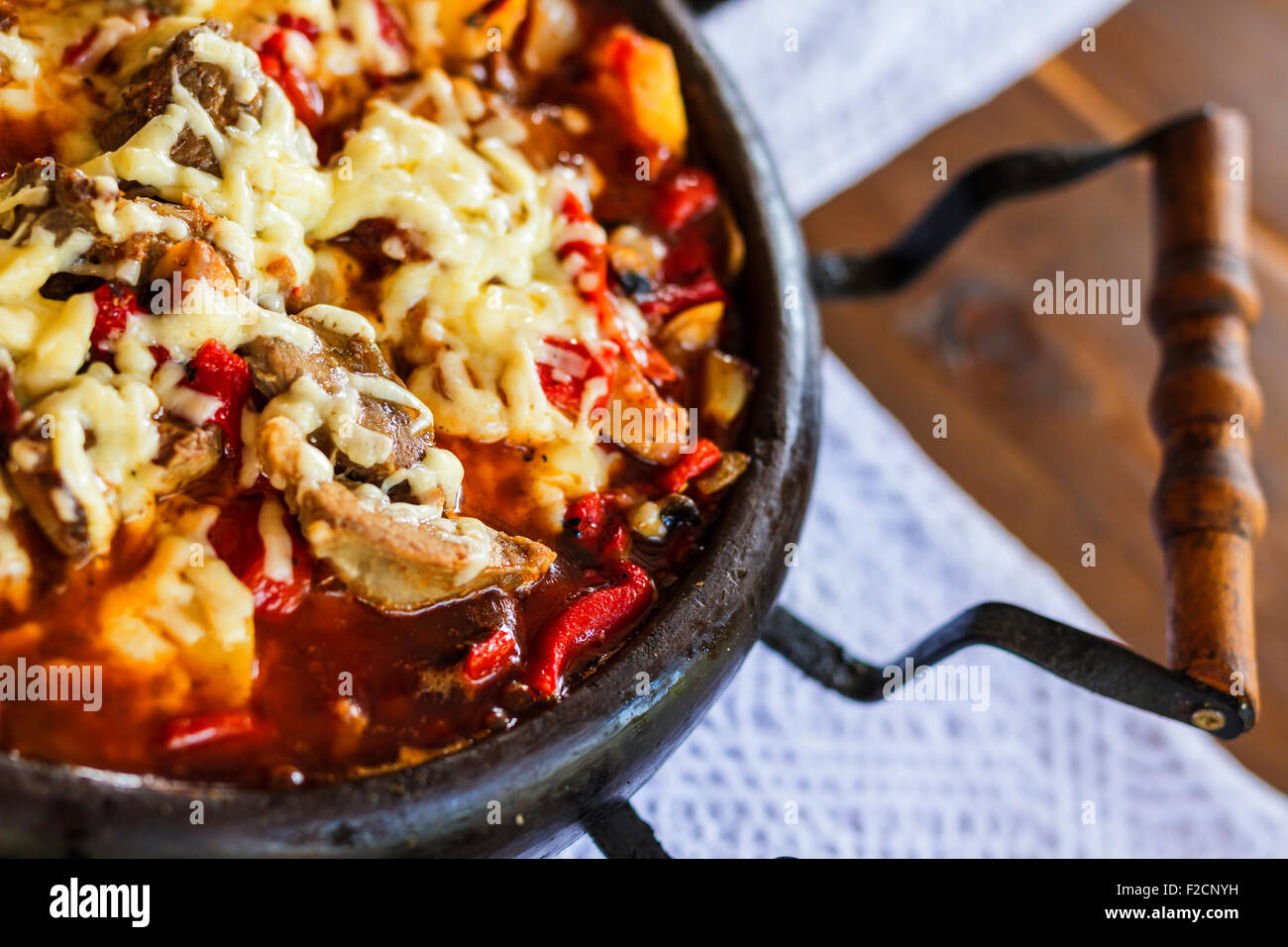 Meat with cheese on clay try. Bulgarian traditional cuisine sach Stock ...