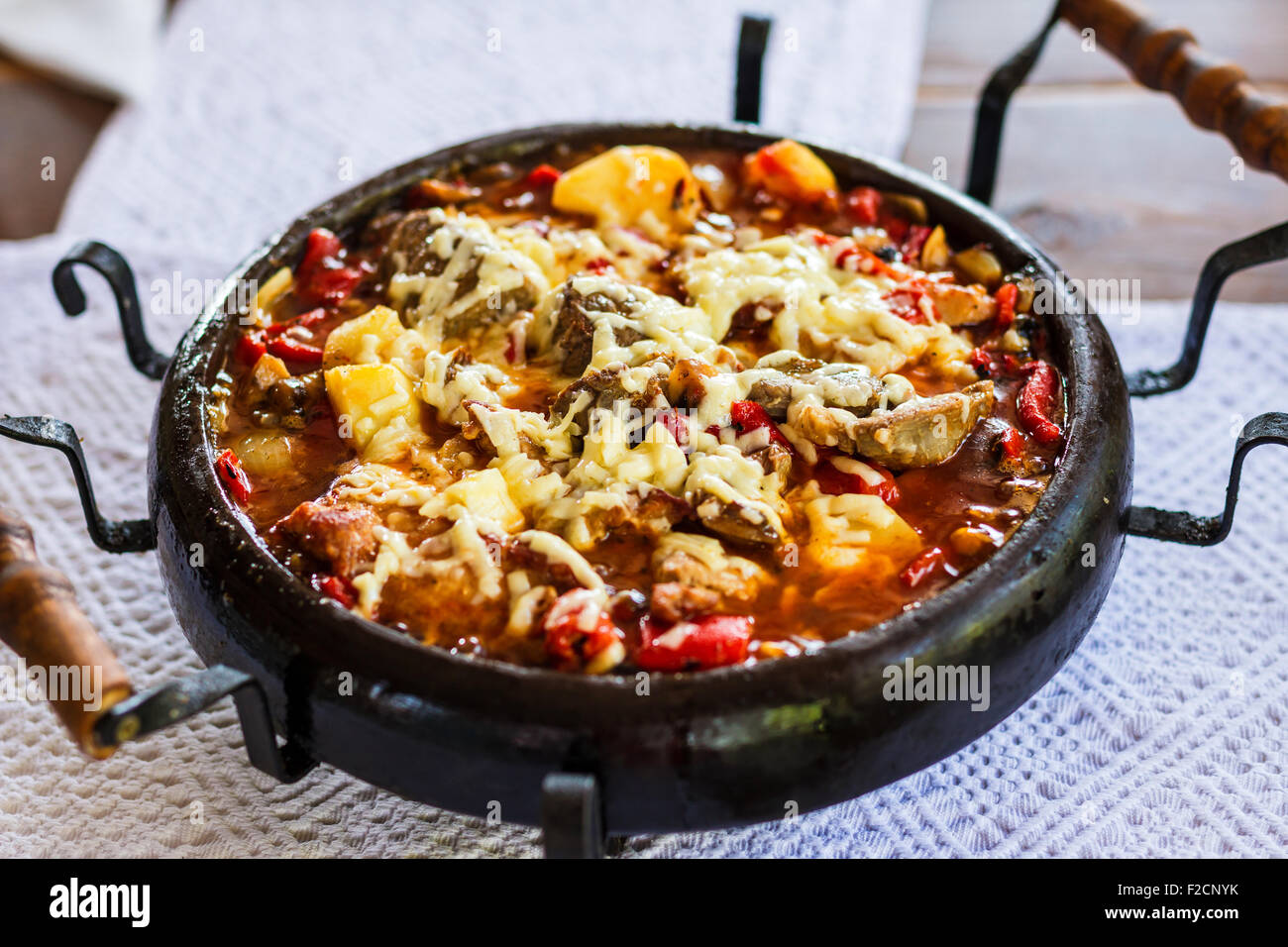Meat with cheese on clay try. Bulgarian traditional cuisine sach Stock ...