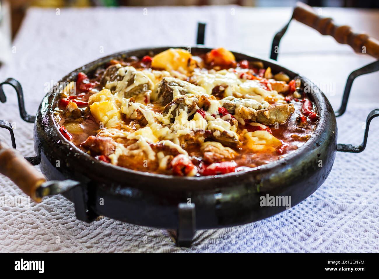 Meat with cheese on clay try. Bulgarian traditional cuisine sach Stock ...