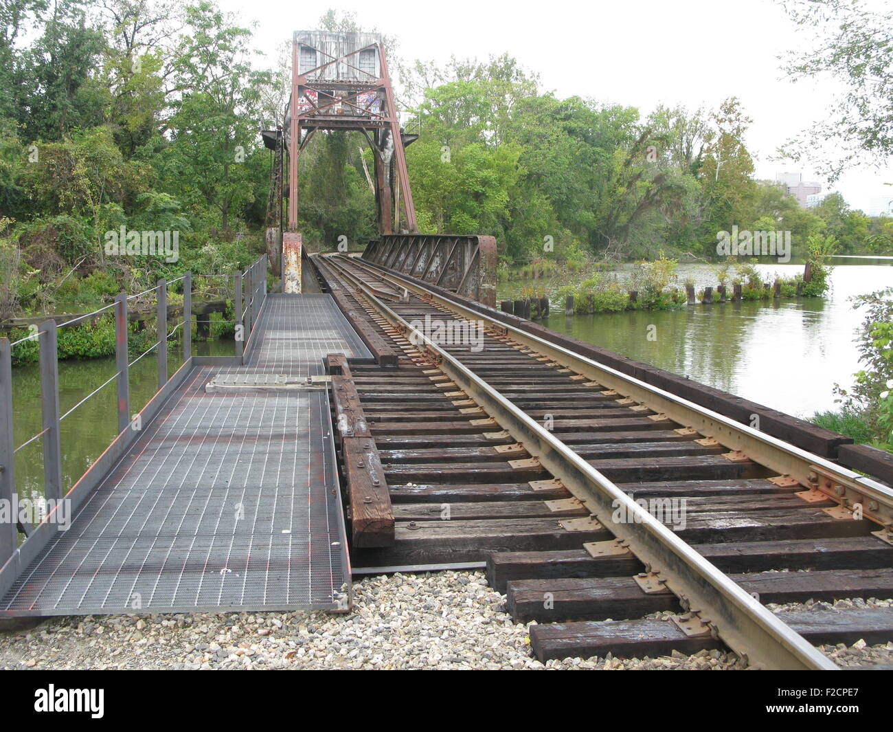 Train tracks across a river Stock Photo - Alamy