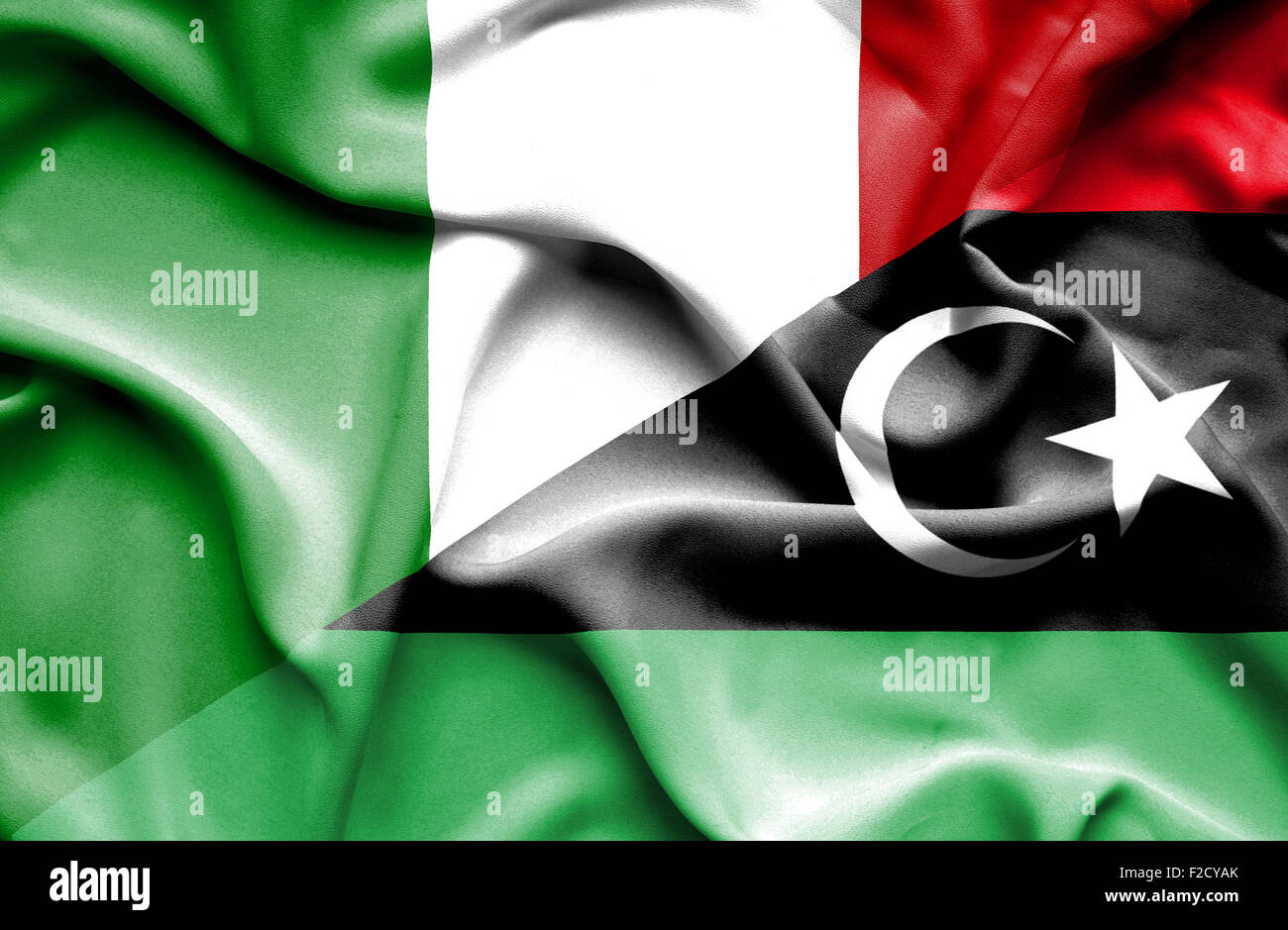 Waving flag of Libya and Italy Stock Photo - Alamy