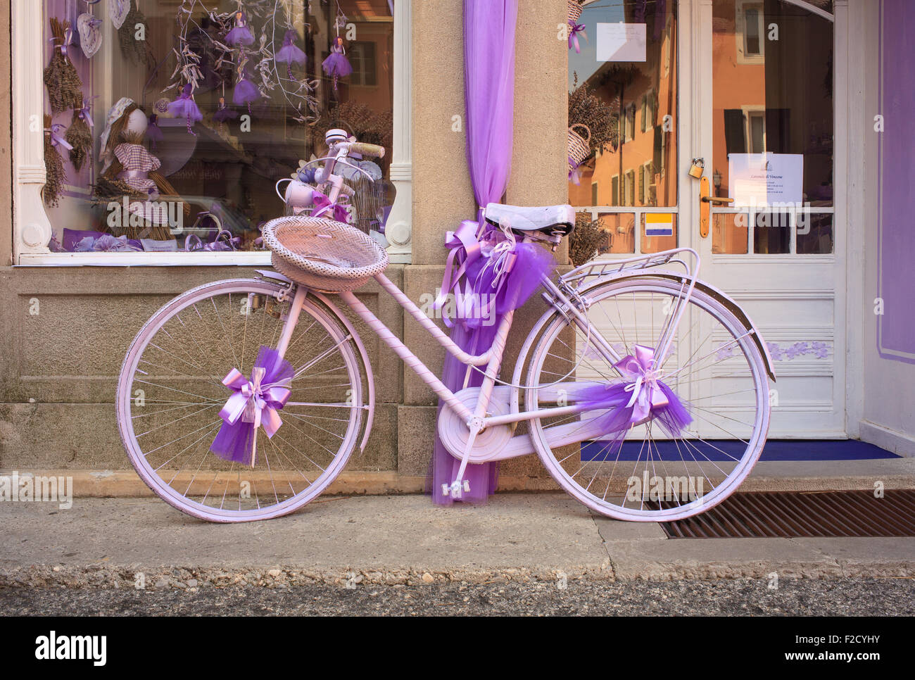 Photo of Purple bike next to a lavender shop Stock Photo - Alamy