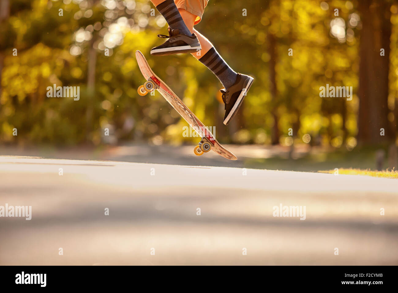 A boy skateboarding outside on a warm summer day Stock Photo - Alamy