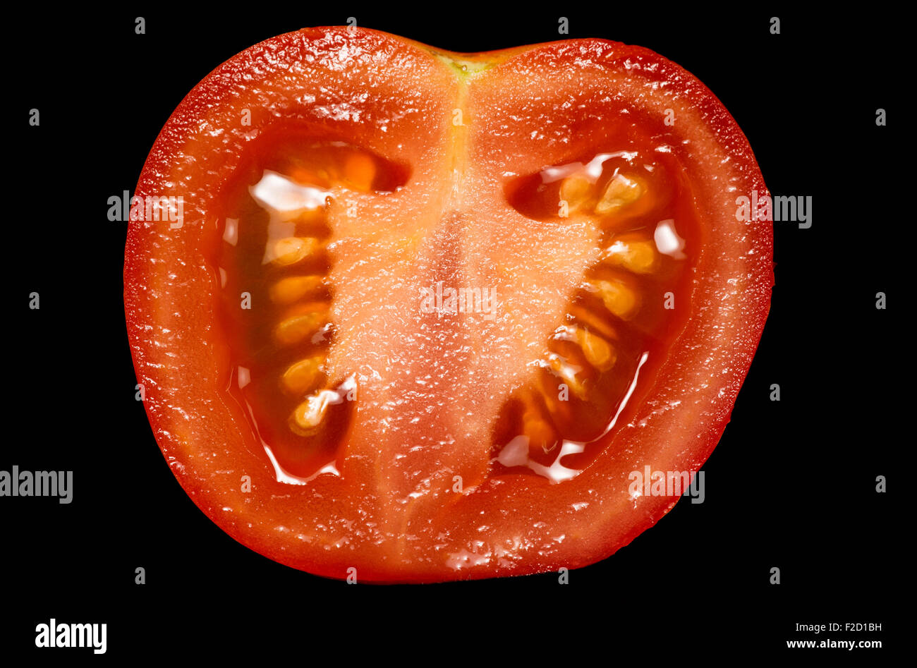 inside of a tomato on black background Stock Photo - Alamy