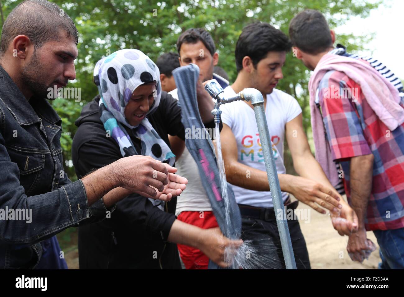Horgos, Serbia. 16th September, 2015. People wash hands and clothes at ...