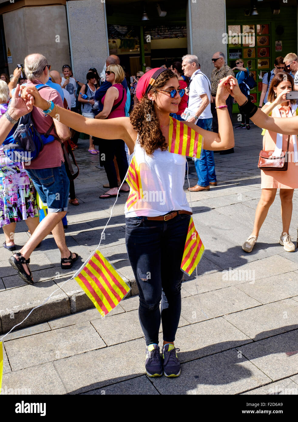 A Catalan girl dancing the Sardana, a traditional dance in the Palau de ...