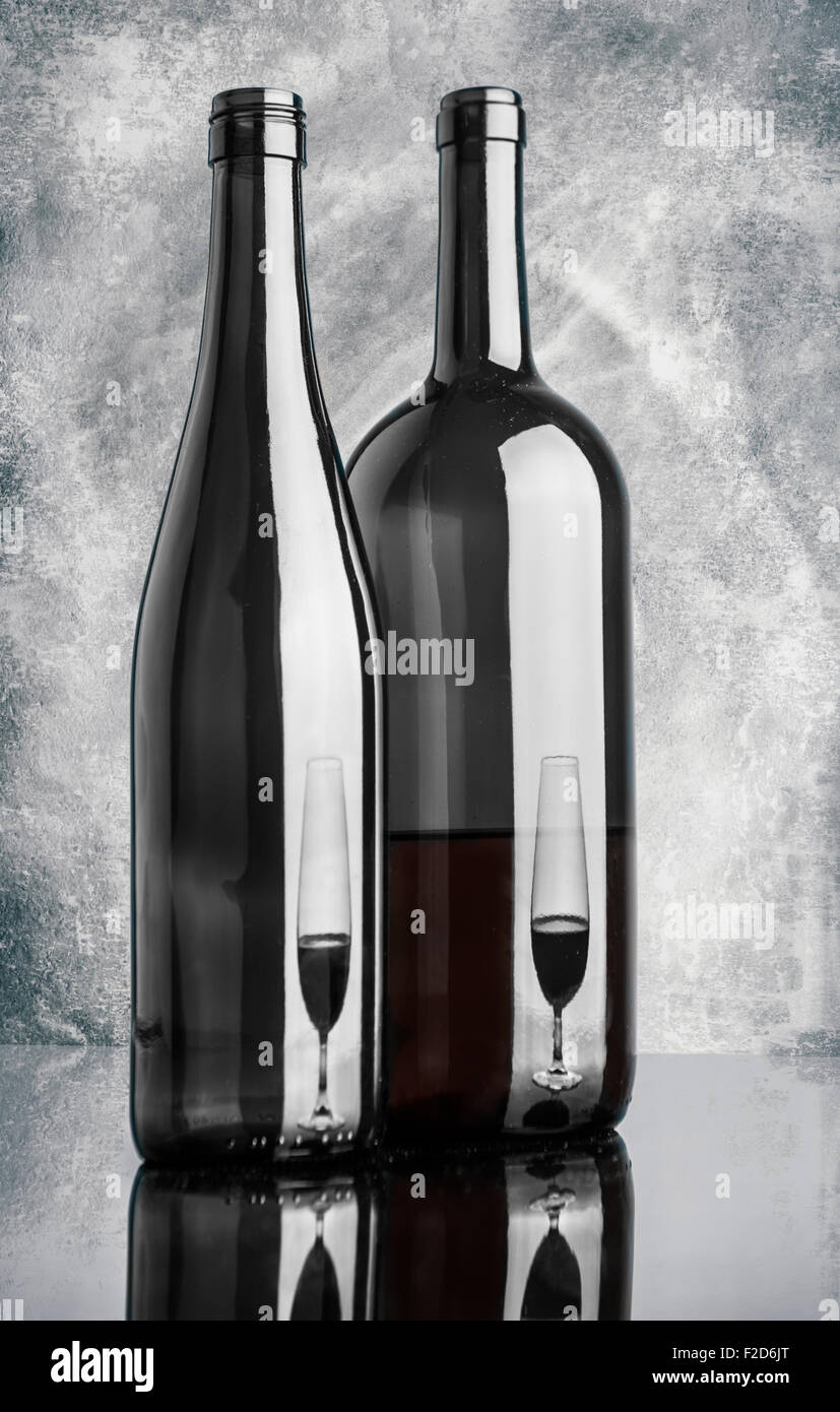 Still life with two bottles and reflections of wine glass Stock Photo ...