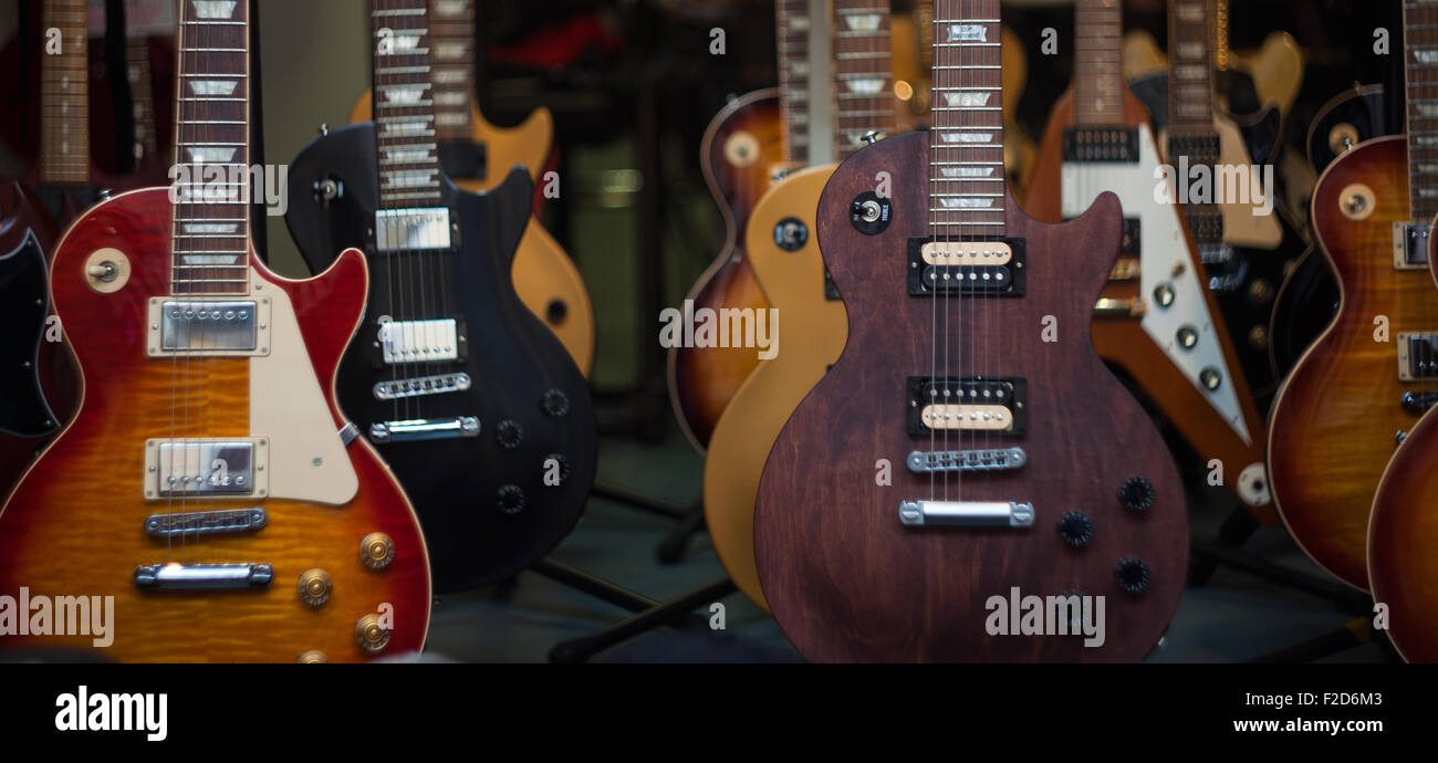 View of many guitars in the shop Stock Photo - Alamy