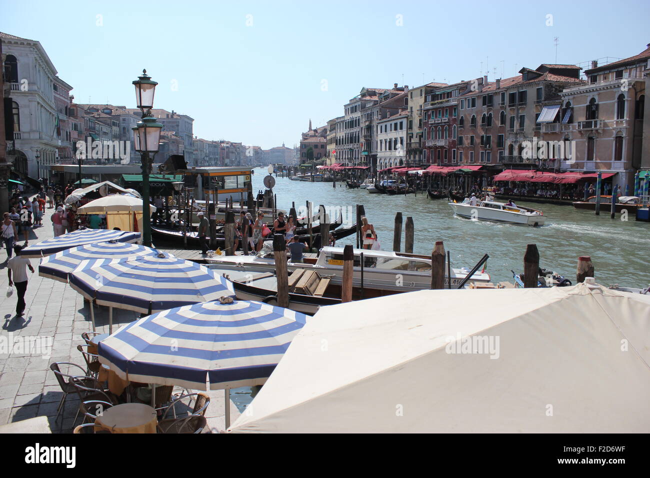 A busy square and gondola docks in Venice Italy Stock Photo - Alamy