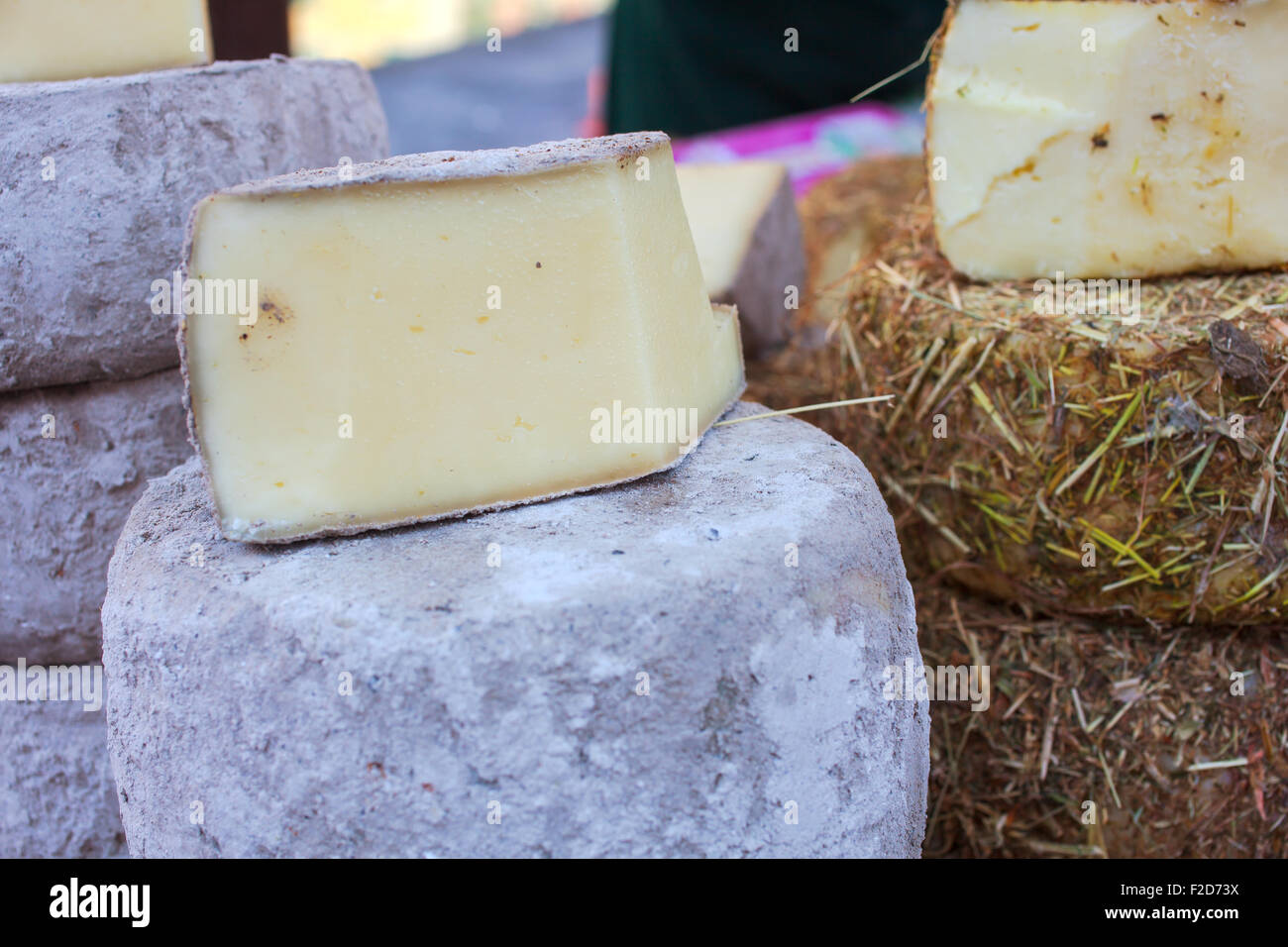 Italian cheeses covered in a layer of hay or cinder Stock Photo - Alamy