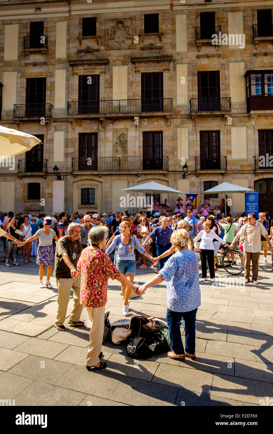 Catalans dancing the Sardana, a traditional dance in the Palau de la ...