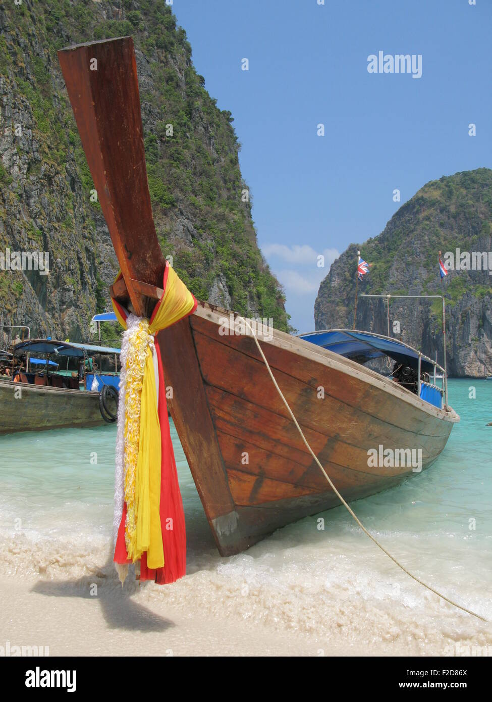 Decorated long tail boat in Maya bay of Phi-Phi island Stock Photo - Alamy