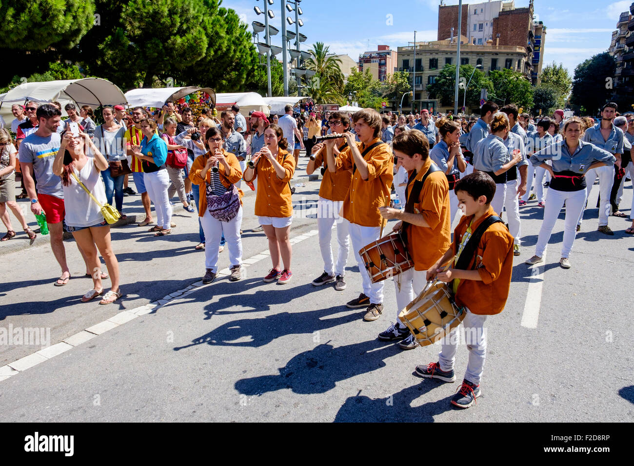 A traditional band plays to accompany the Castellers building human ...