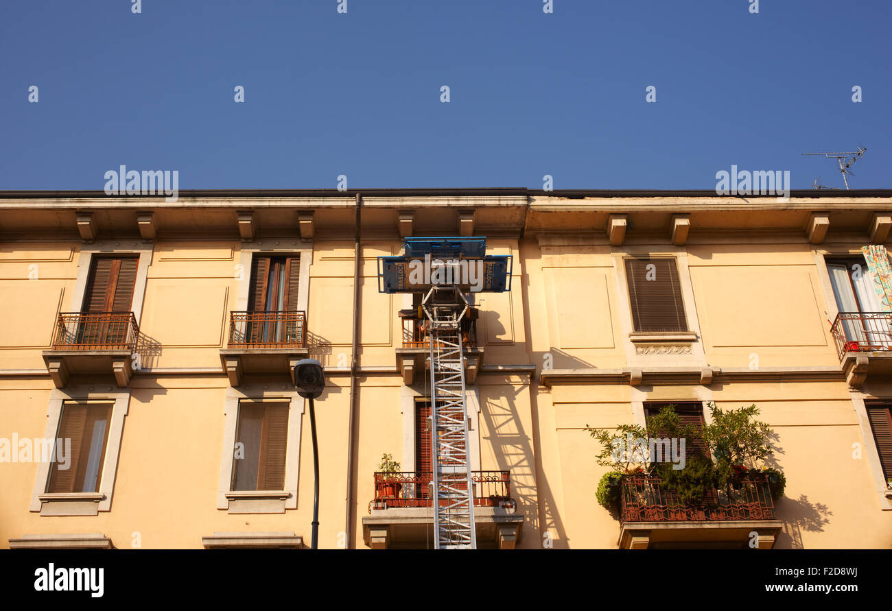 Extendable lift in action on a balcony, Milan Stock Photo - Alamy