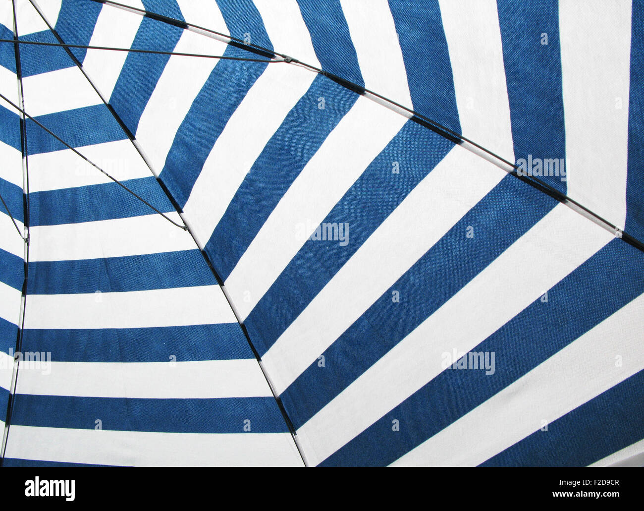 Striped sun umbrella Stock Photo - Alamy