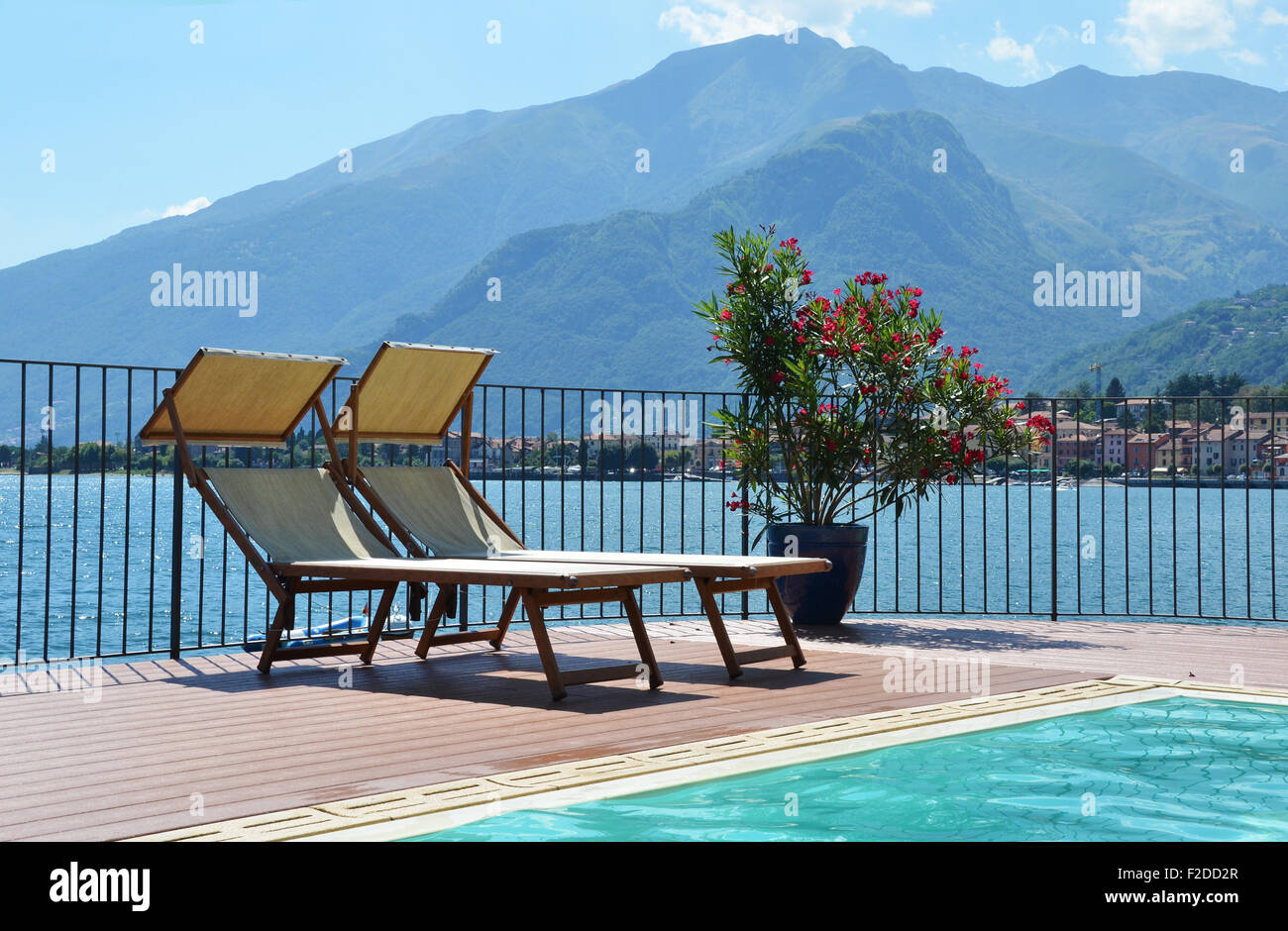 Two sundeds against Como lake, Italy Stock Photo - Alamy