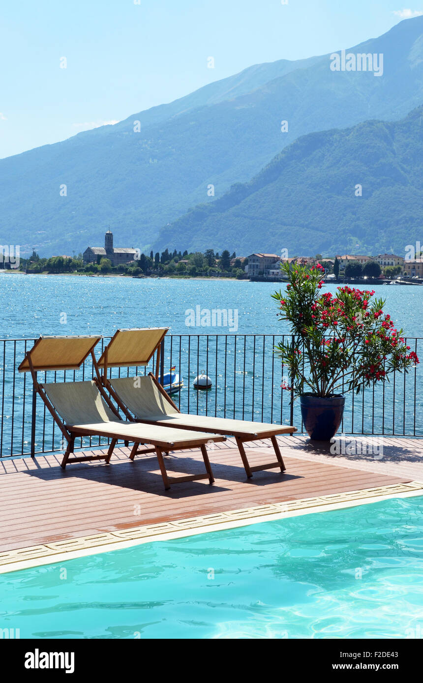 Sunbeds against Como lake, Italy Stock Photo - Alamy