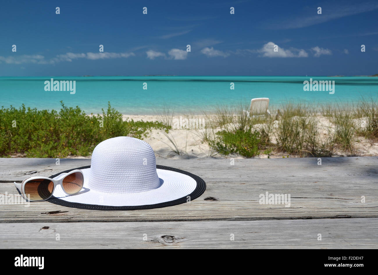 Hat and sunglasses on the beach of Exuma, Bahamas Stock Photo - Alamy