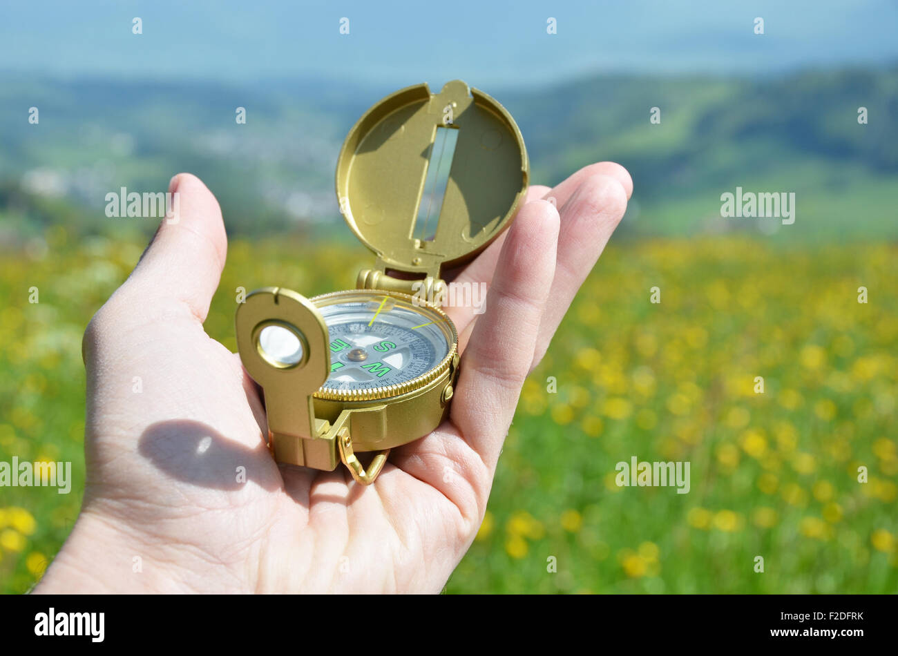 Compass in the hand Stock Photo - Alamy