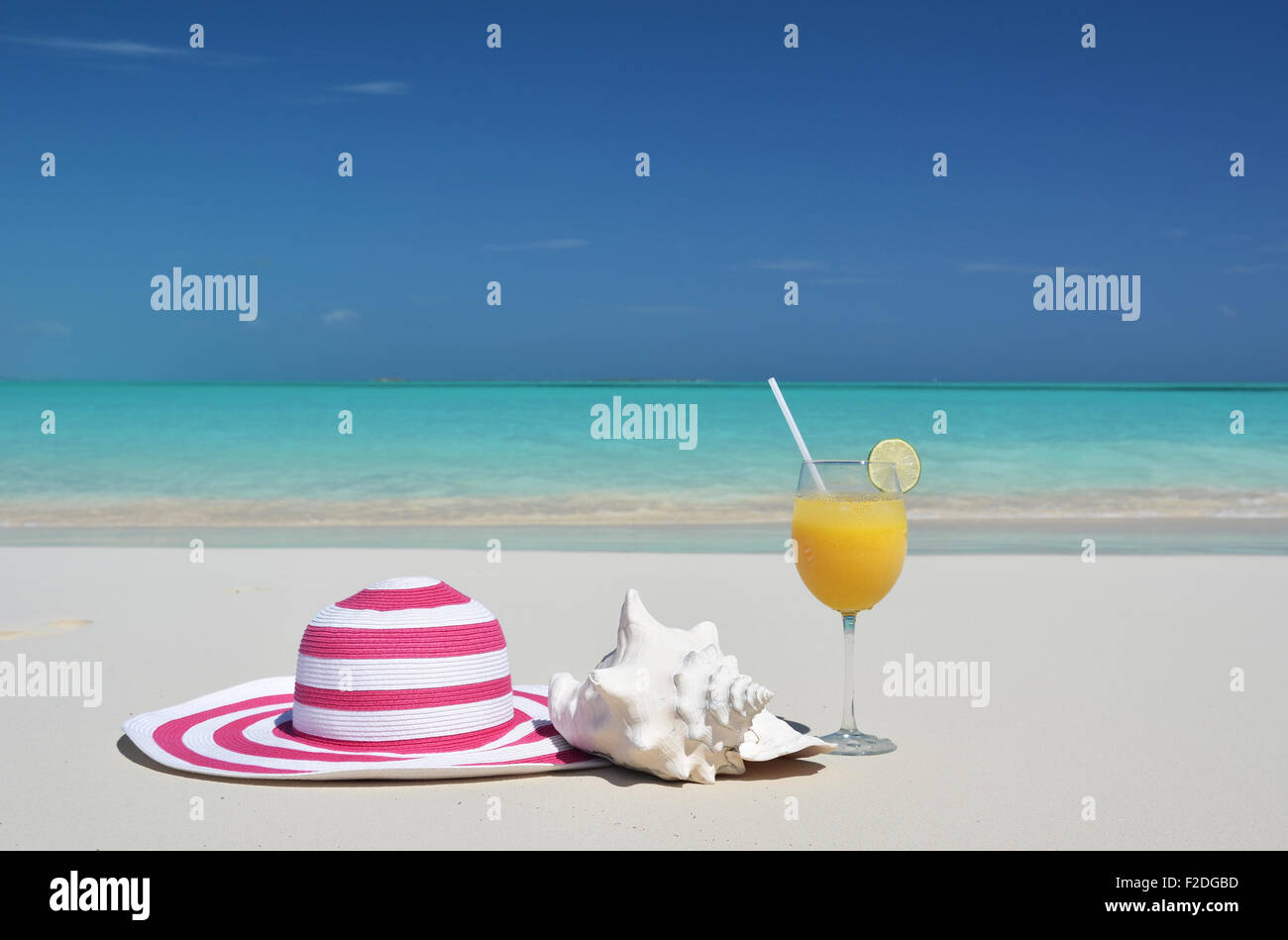 Hat and orange juice. Exuma, Bahamas Stock Photo - Alamy