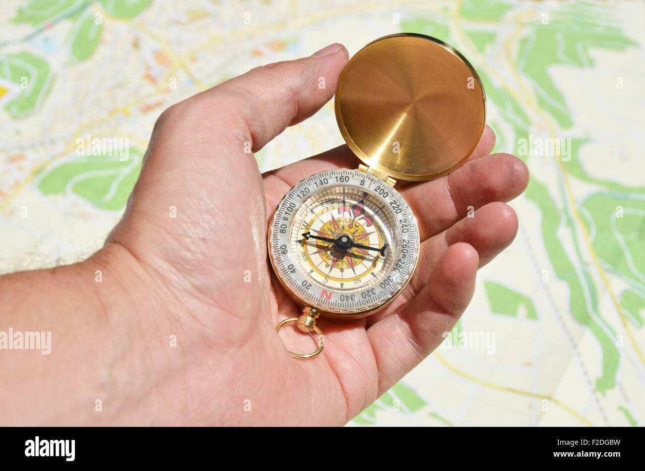 Compass in the hand Stock Photo - Alamy