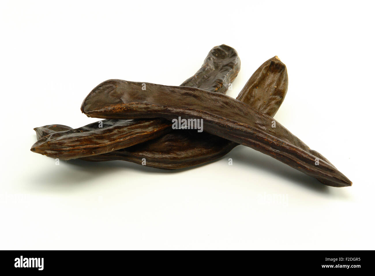 Dried carob fruit Cut Out Stock Images & Pictures - Alamy