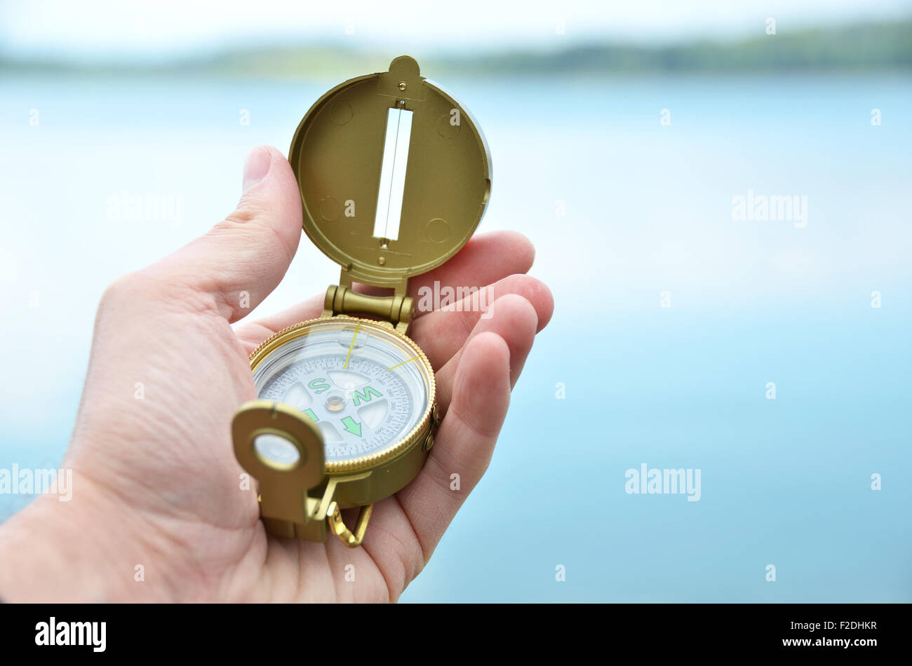 Compass in the hand Stock Photo - Alamy