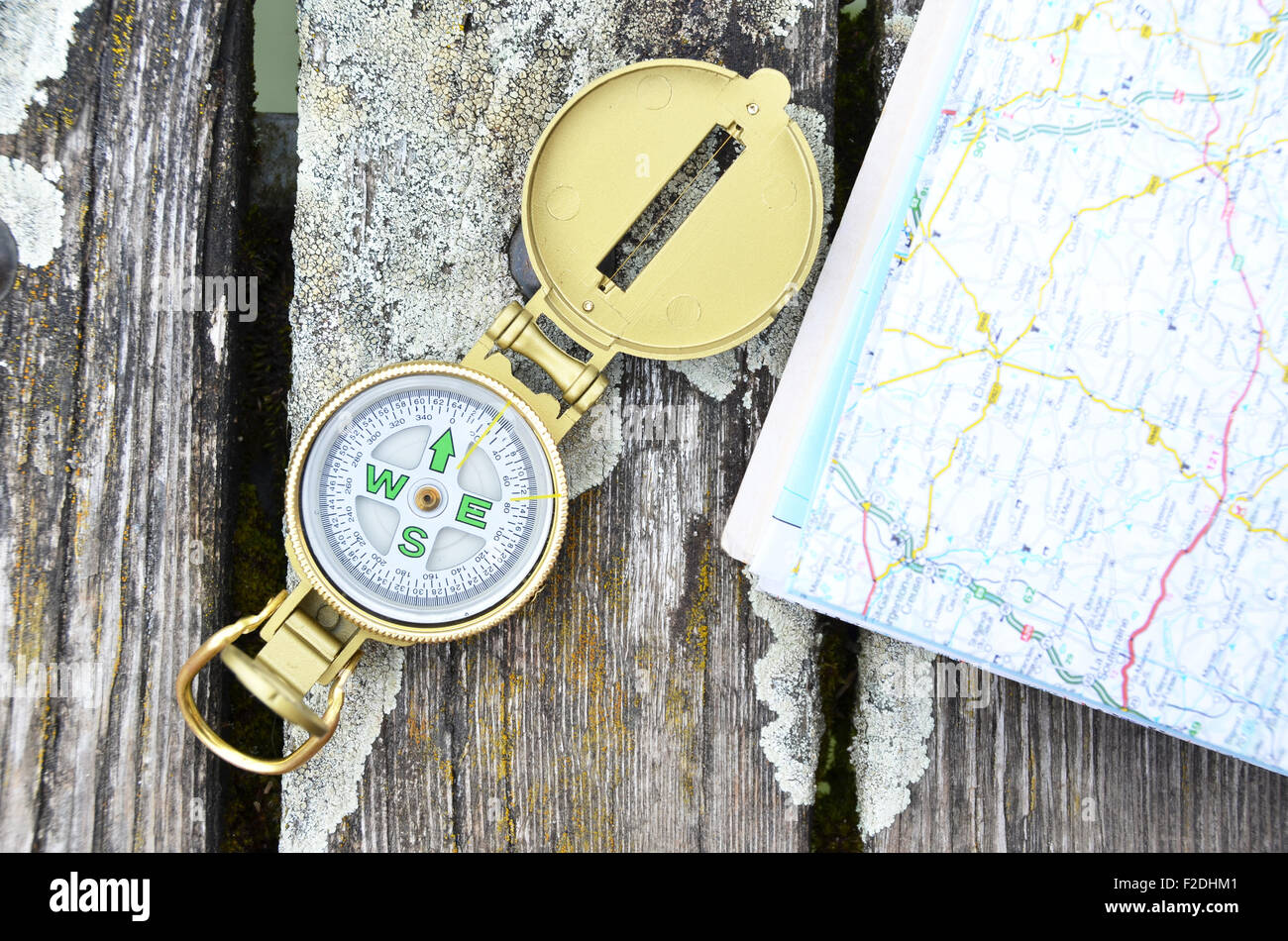 Compass and map Stock Photo - Alamy