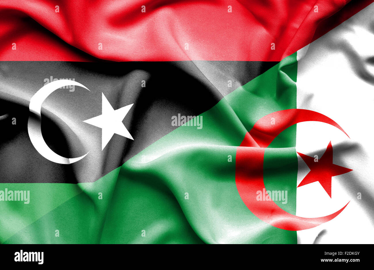 Waving flag of Algeria and Libya Stock Photo - Alamy