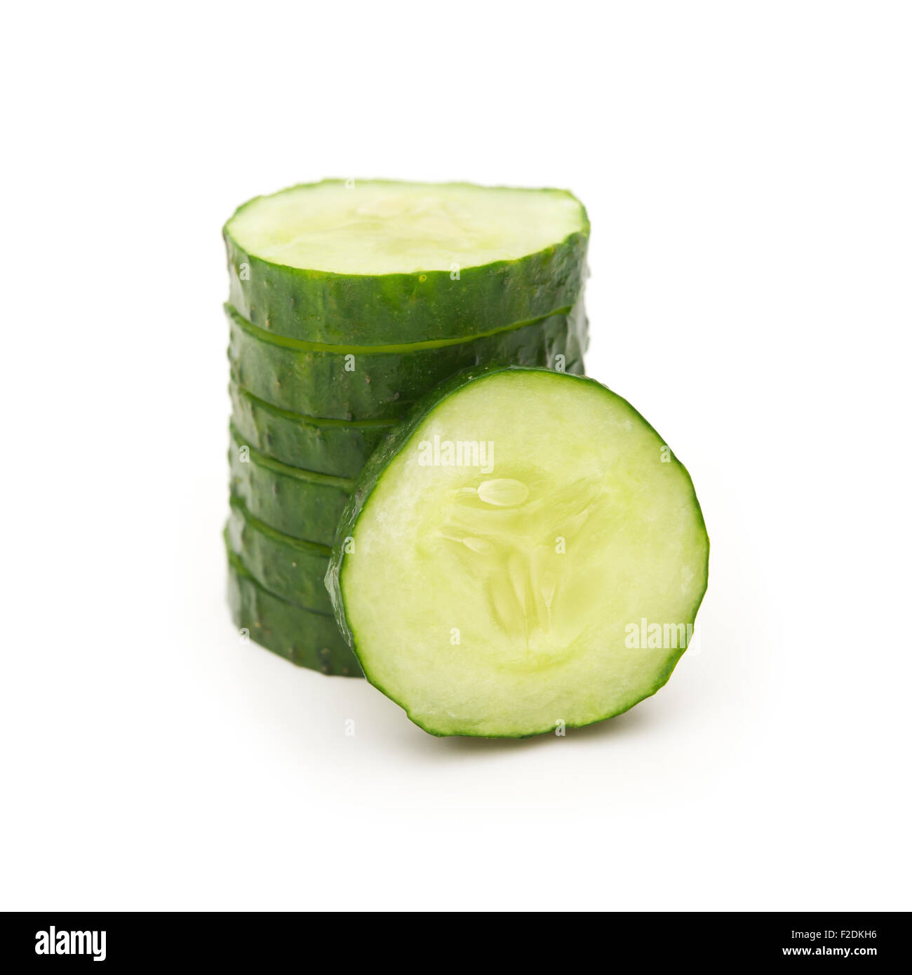 fresh cucumber slices stack up on a white background Stock Photo - Alamy