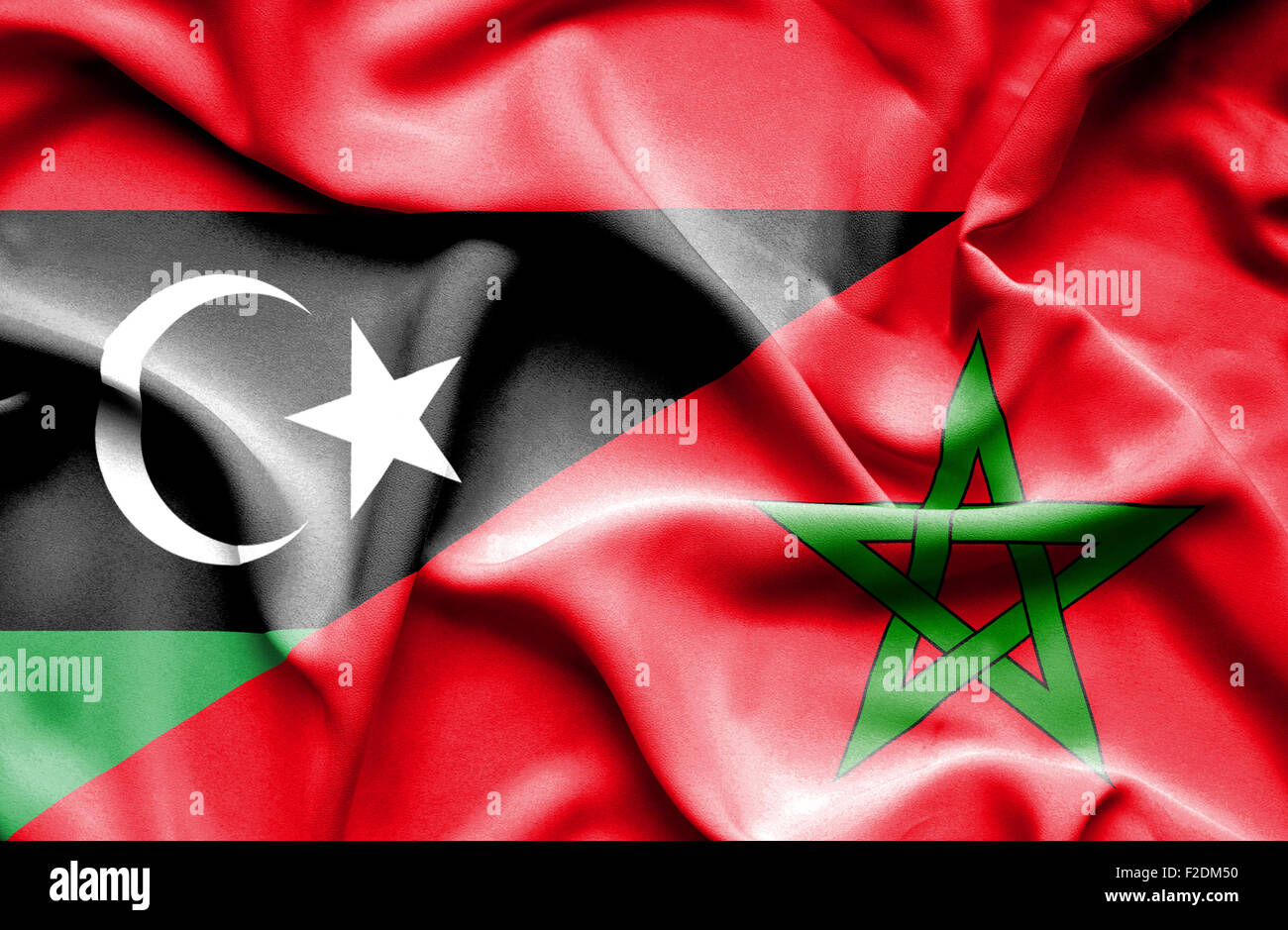 Waving flag of Morocco and Libya Stock Photo - Alamy