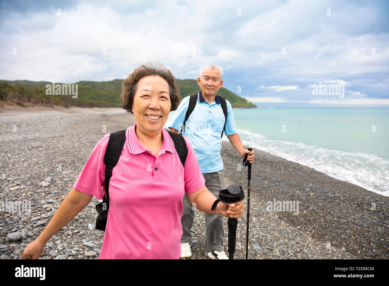 Senior woman having fun on the beach hi-res stock photography and ...