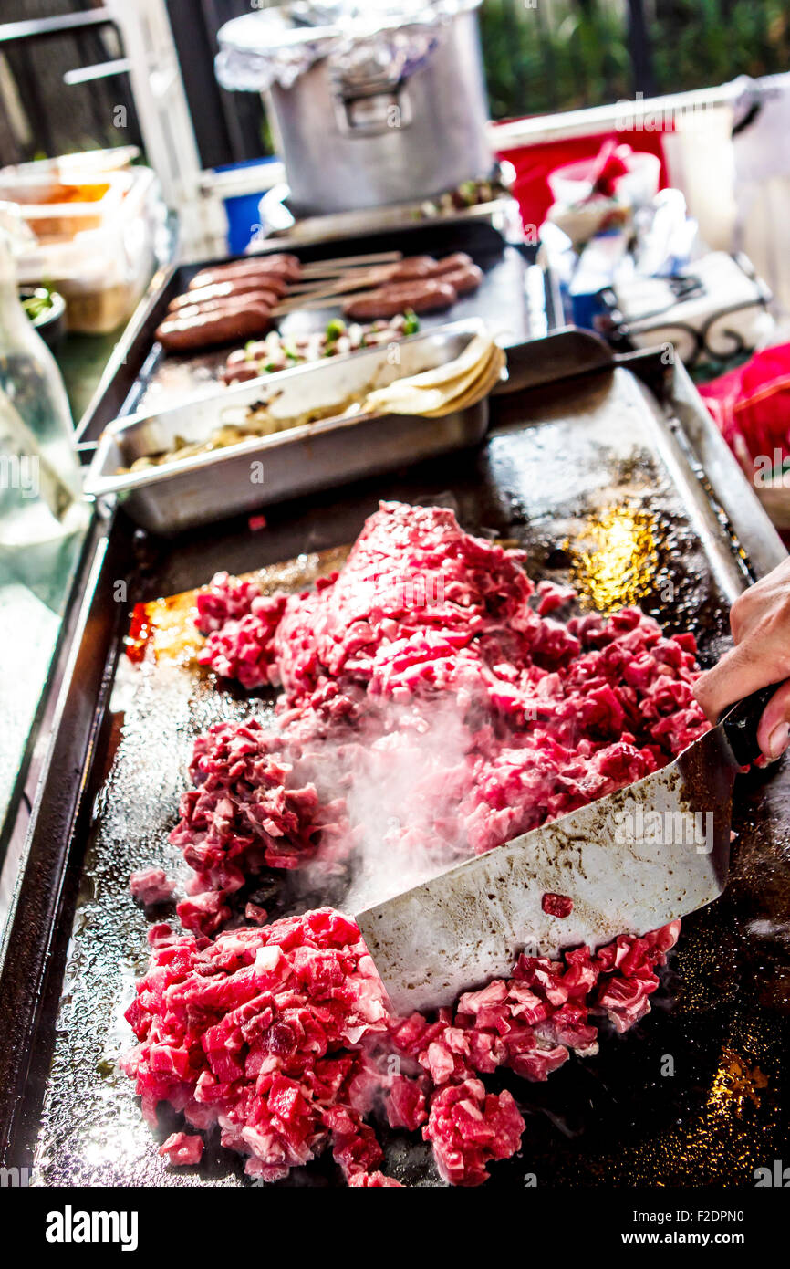 Mexican grilled chopped beef street food and cleaver Stock Photo - Alamy