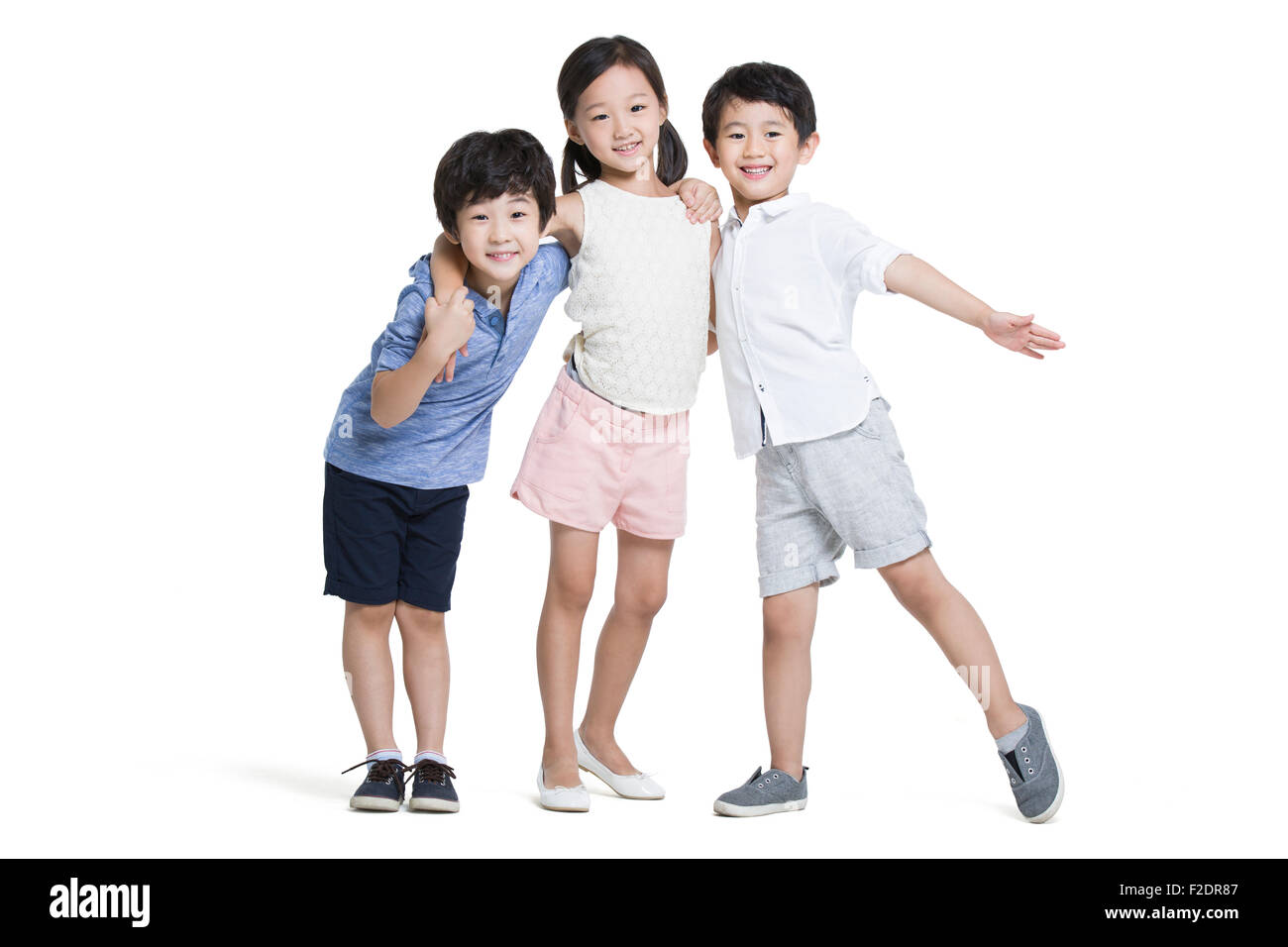 Three happy children playing on Cut Out Stock Images & Pictures - Alamy