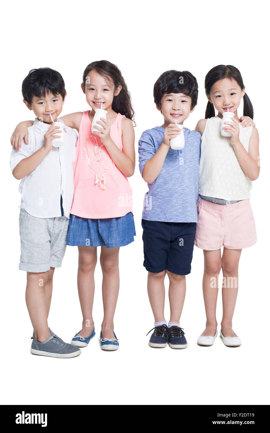 Happy children drinking yogurt Stock Photo - Alamy