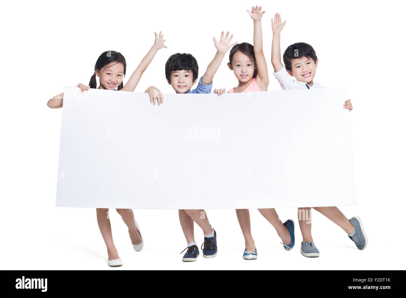 Happy children with whiteboard Stock Photo - Alamy