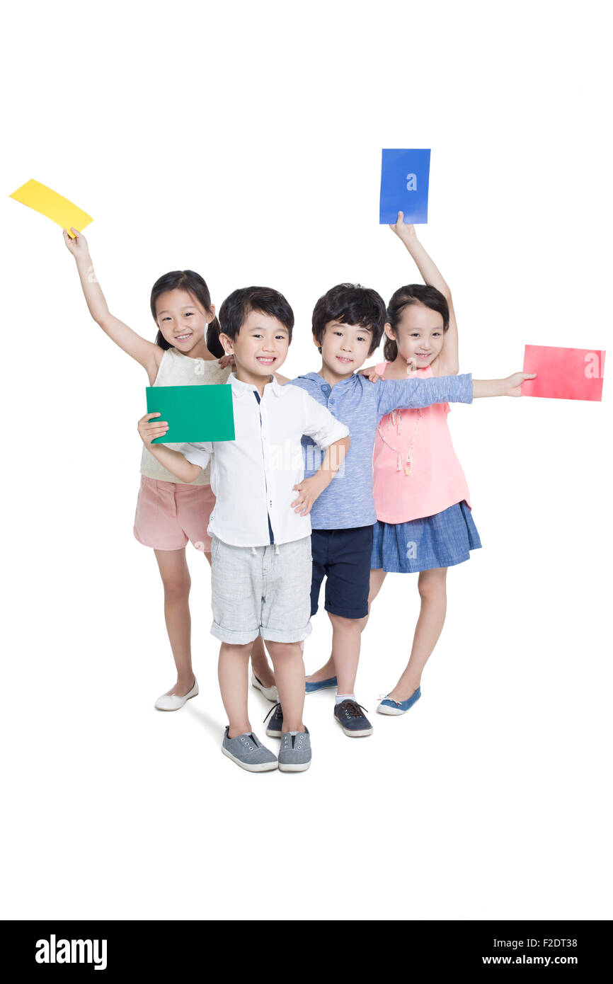 Happy children with colorful paper Stock Photo - Alamy