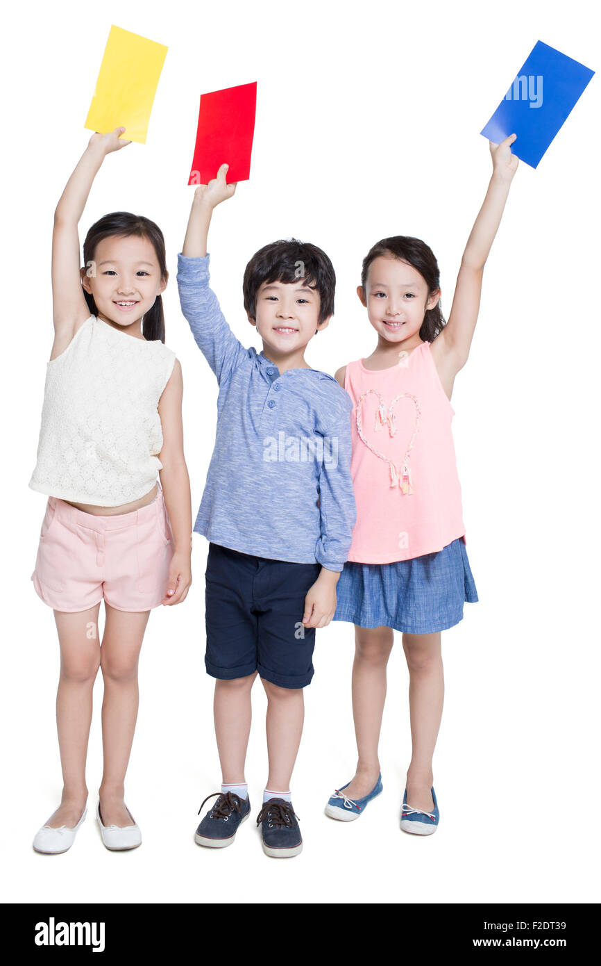 Happy children with colorful paper Stock Photo - Alamy