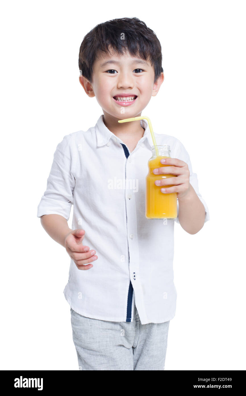Happy boy drinking juice Stock Photo - Alamy