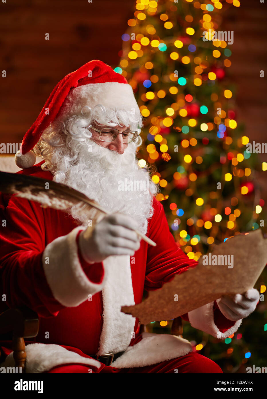 Santa Claus with feather answering Christmas letter Stock Photo - Alamy