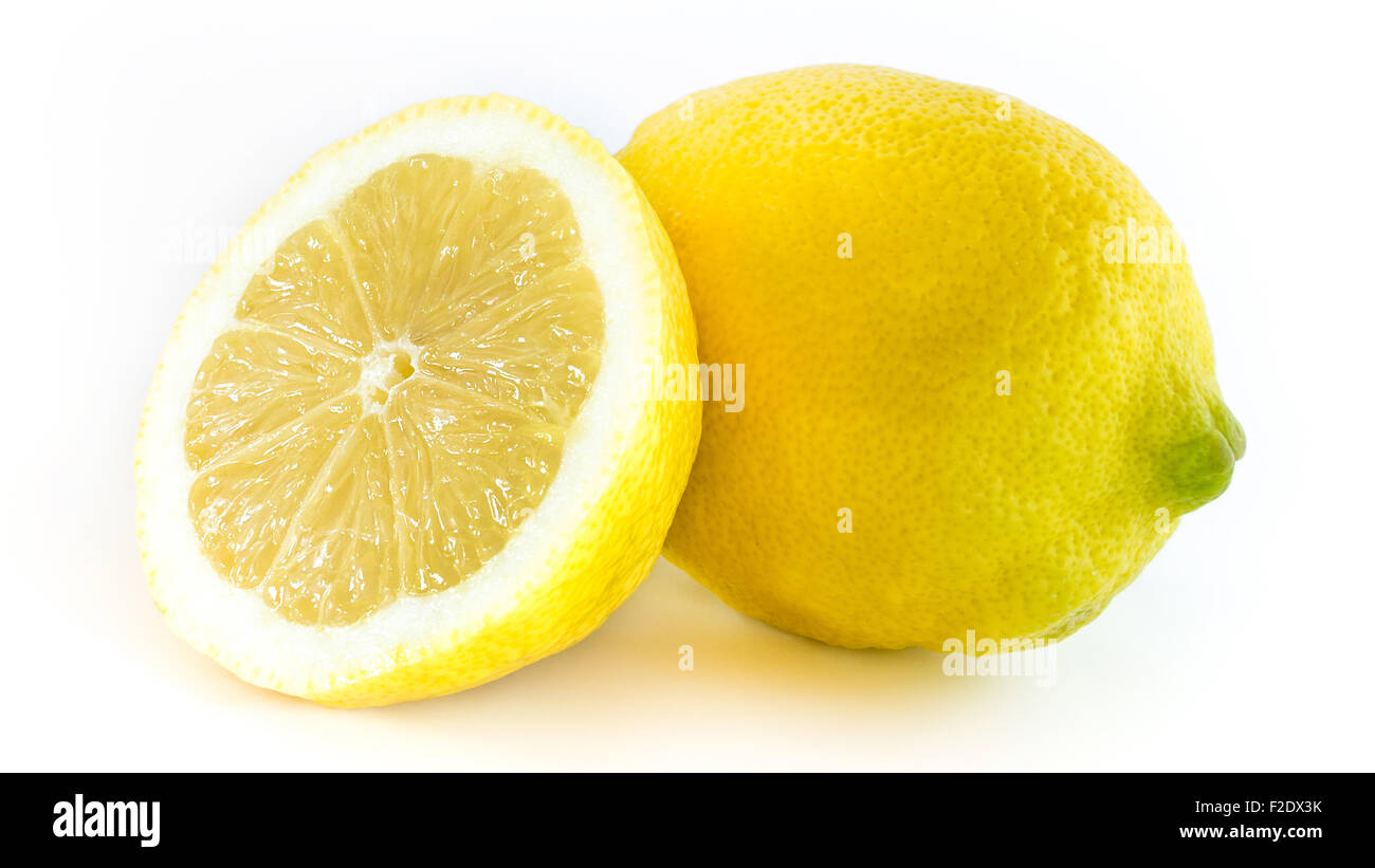A whole lemon and one cut in half, isolated on white backdrop Stock ...